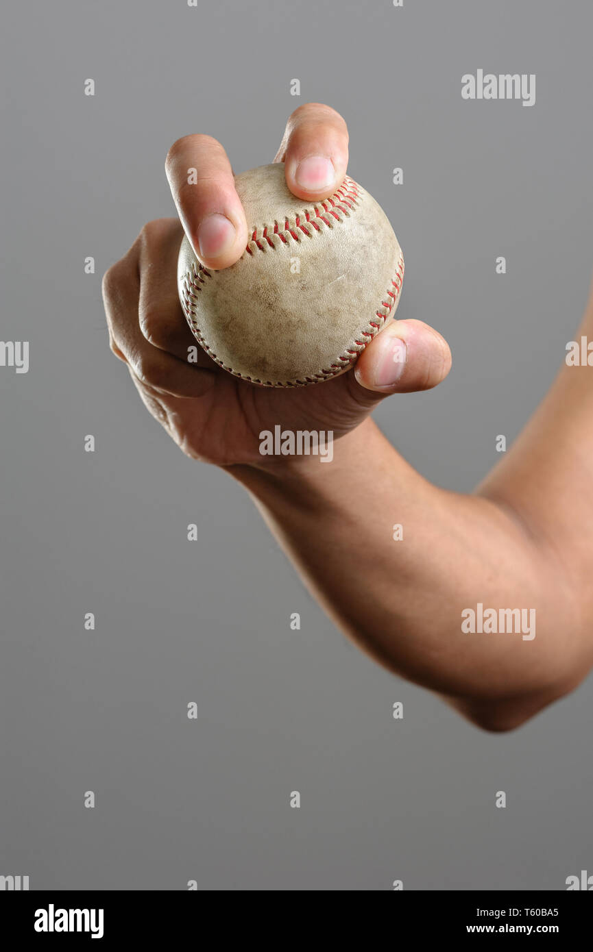 closeup baseball in man's hand, isolated over background Stock Photo ...