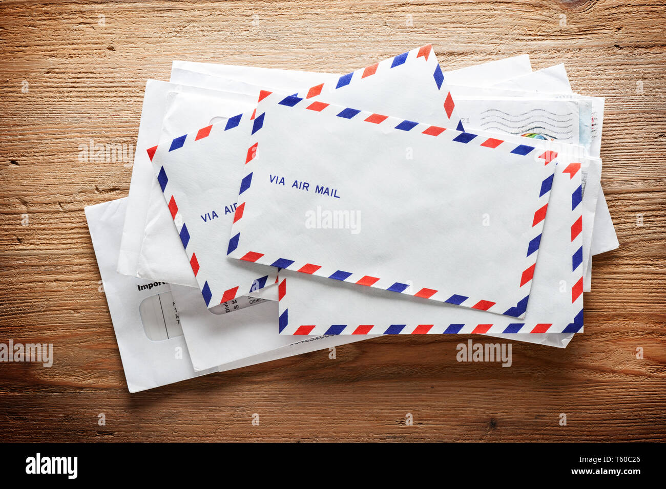 air mail envelope on the wood table Stock Photo - Alamy
