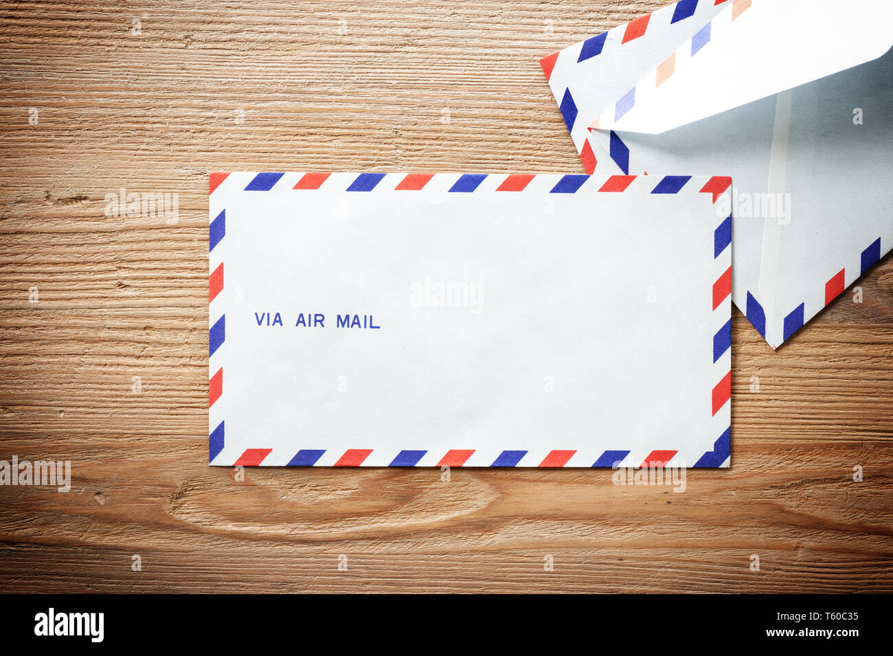 air mail envelope on the wood table Stock Photo - Alamy