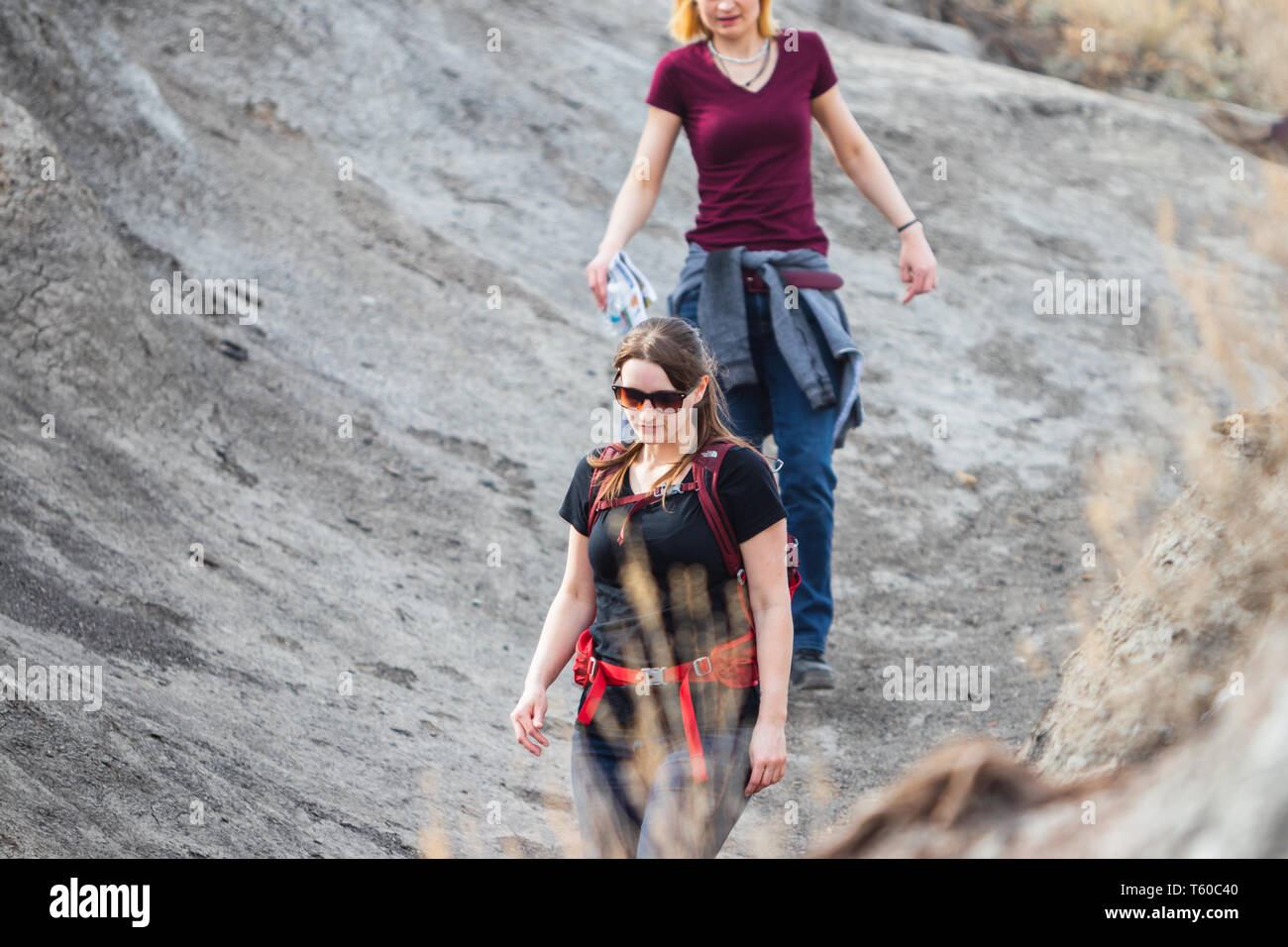 Drumheller, Alberta / Canada - 17. April 2019: People wandering around ... Drumheller, Alberta / Canada - 17. April 2019: People wandering around ...