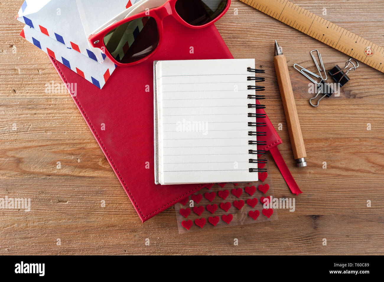 wooden desktop with blank notebook paper background, writing concept ...