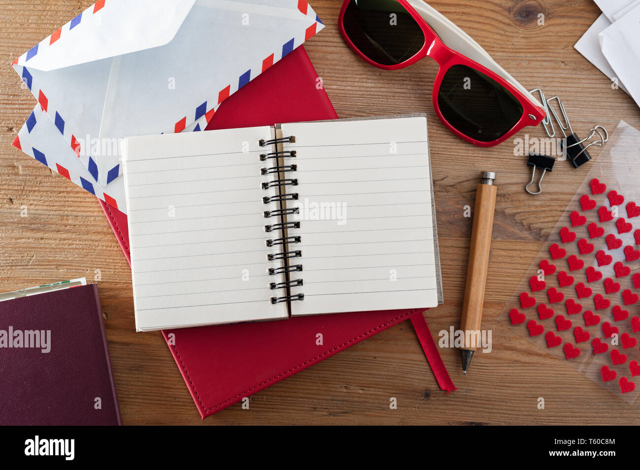 wooden desktop with blank notebook paper background, writing concept ...