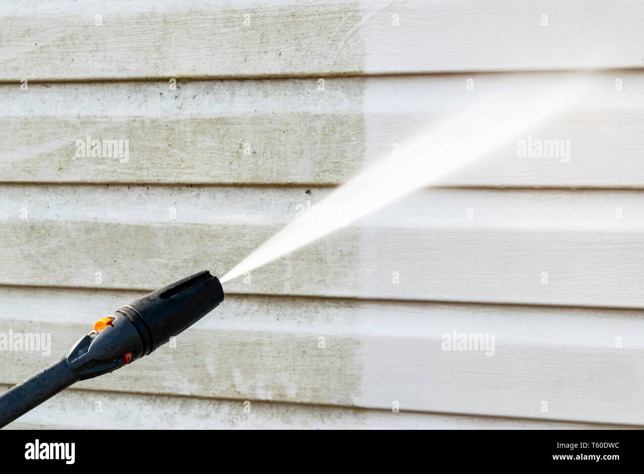 Cleaning service washing building facade with pressure water. Cleaning ...