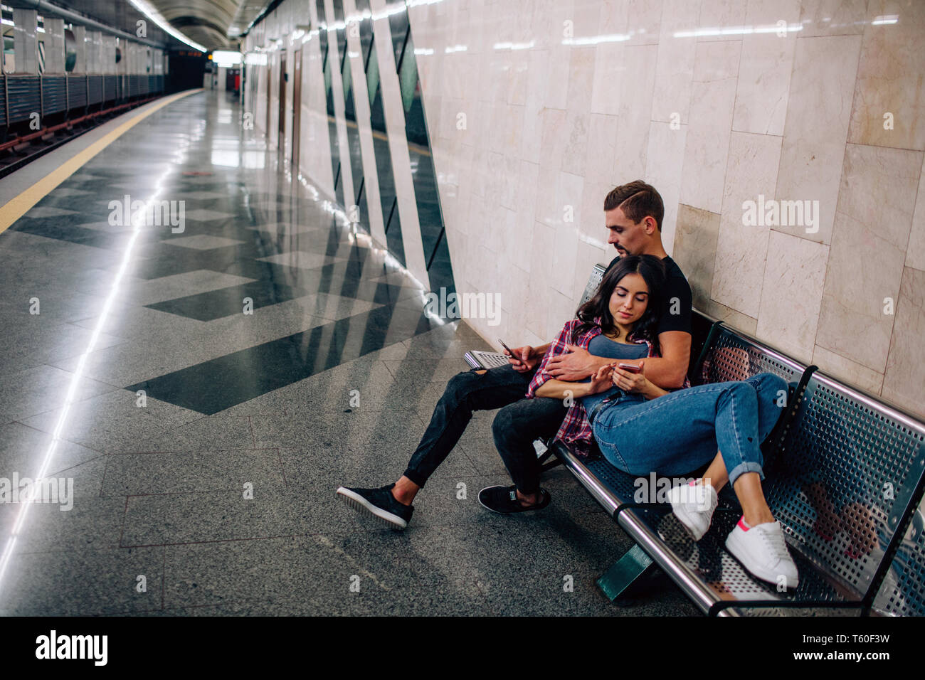 Woman sitting in metro carriage hi-res stock photography and images - Alamy