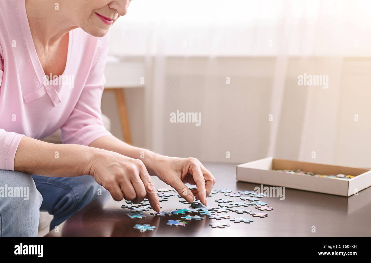 Mature woman puzzle hi-res stock photography and images - Alamy