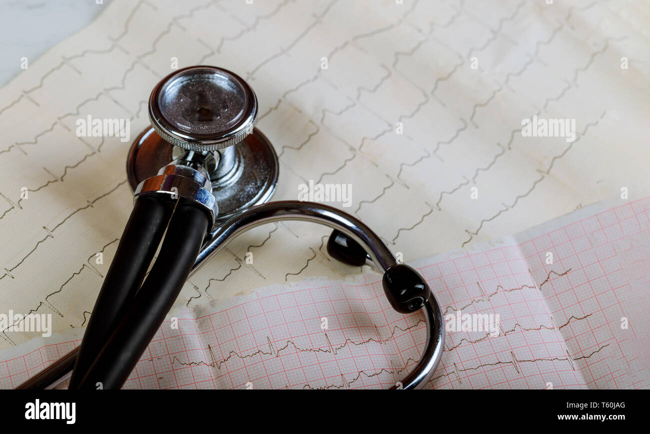 Stethoscope with cardiogram on a medical tools lying on ECG Stock Photo ...