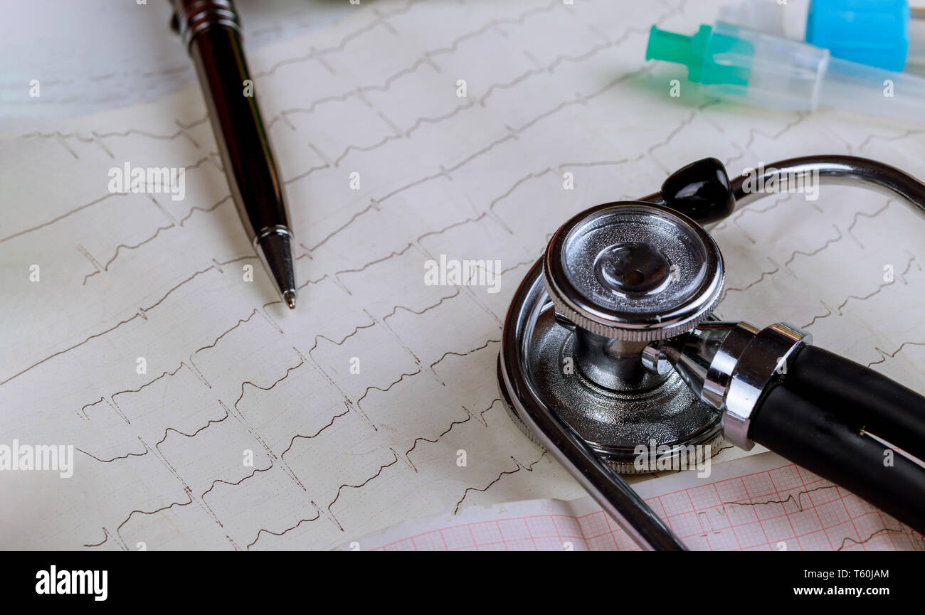 Stethoscope and cardiogram on ecg graph measuring heart beats Stock ...