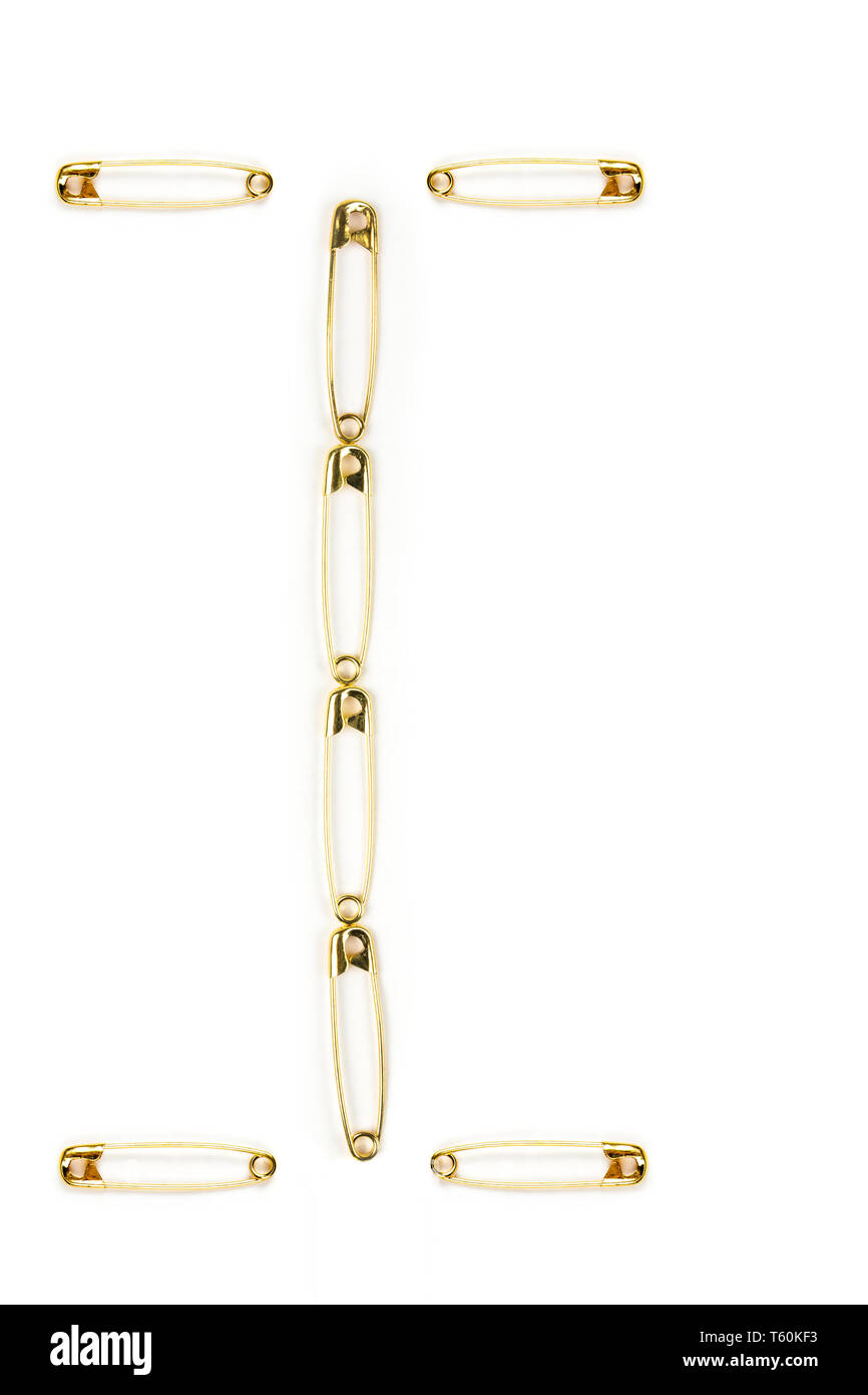 The letter "I" in gold colored safety pins Stock Photo - Alamy
