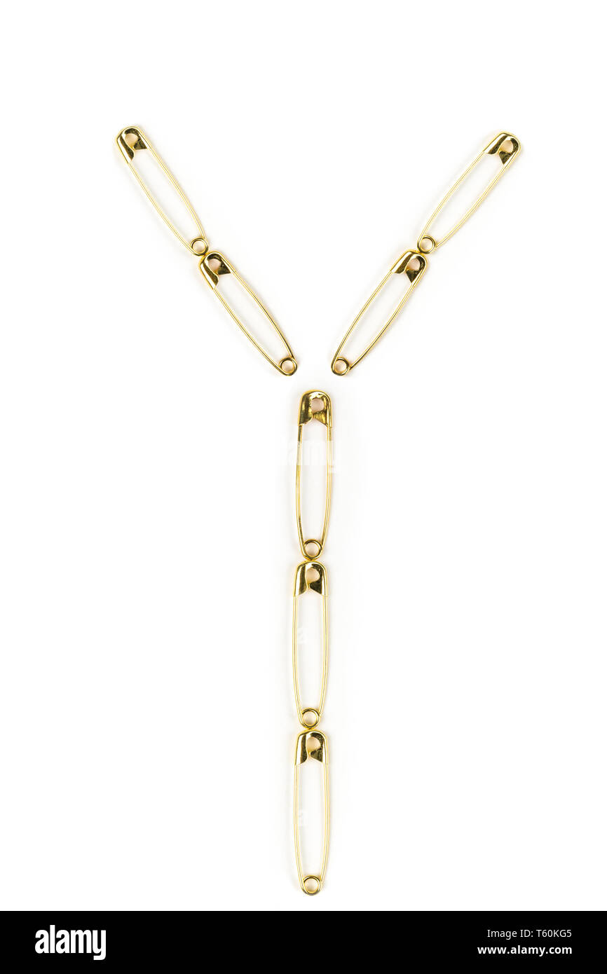 The letter "Y" in gold colored safety pins Stock Photo - Alamy