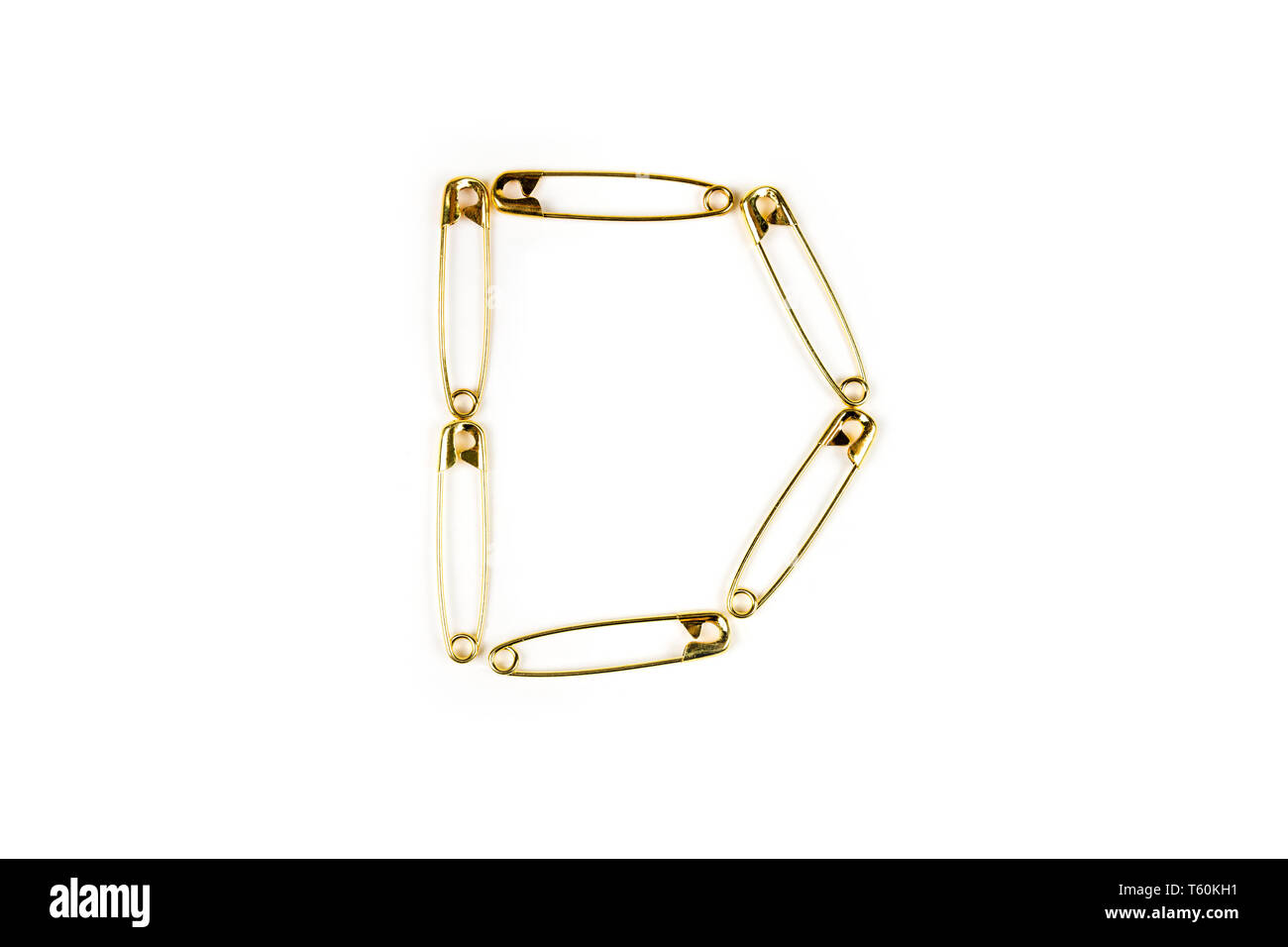 Half circle shape made of safety pins on a white background Stock Photo ...