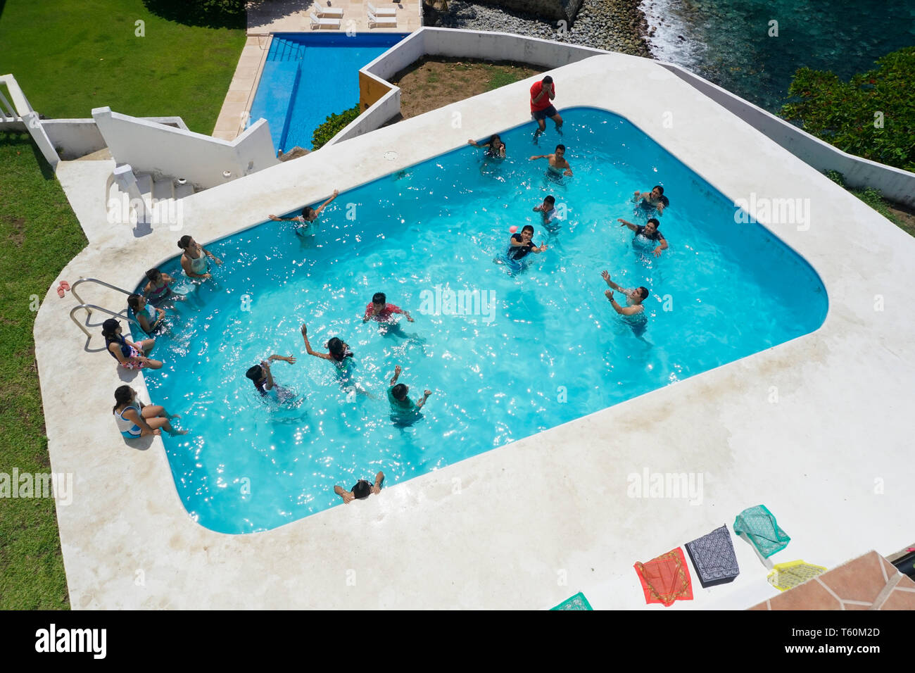 Teens in swimming pool hi-res stock photography and images - Alamy