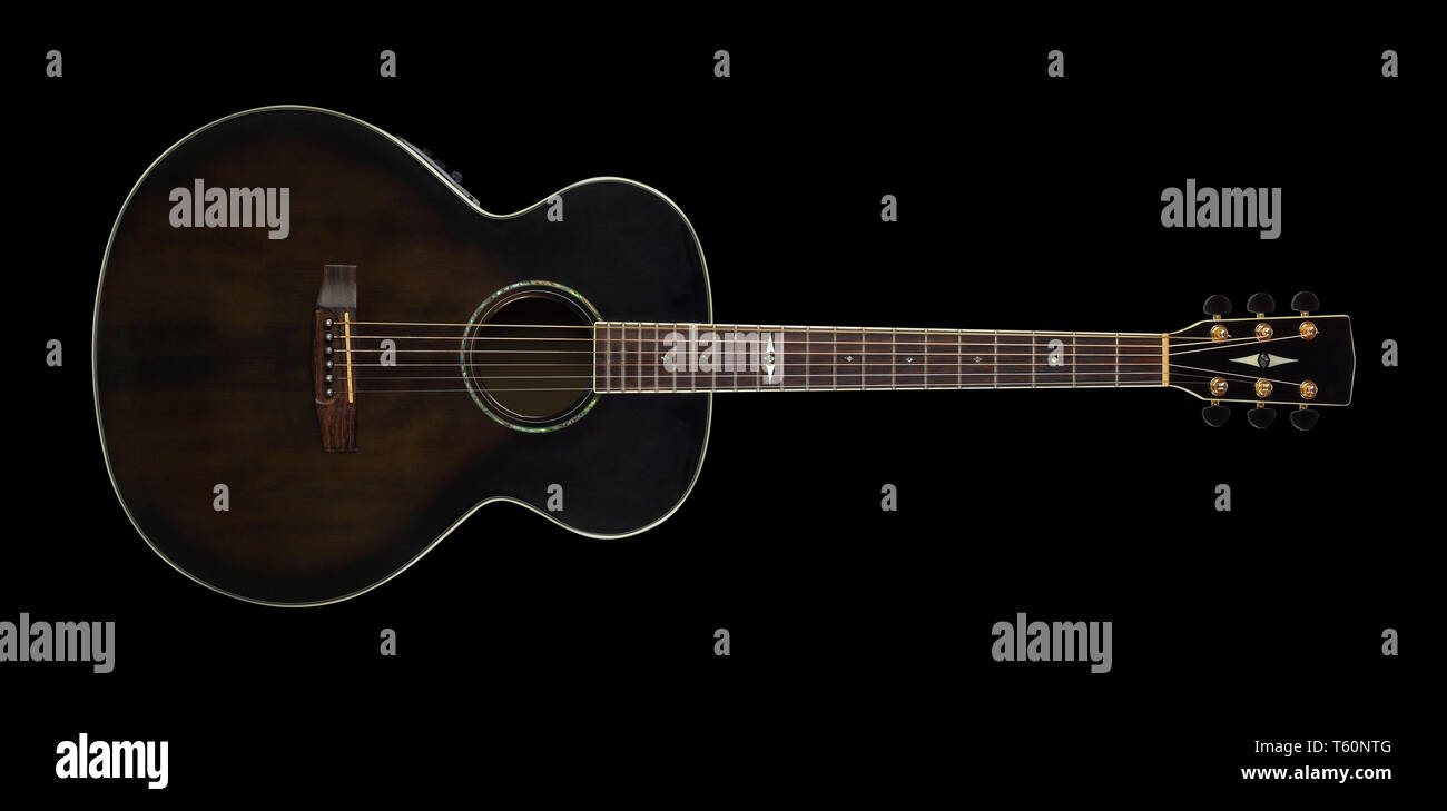 Musical instrument - Top view brown acoustic guitar on a black ...