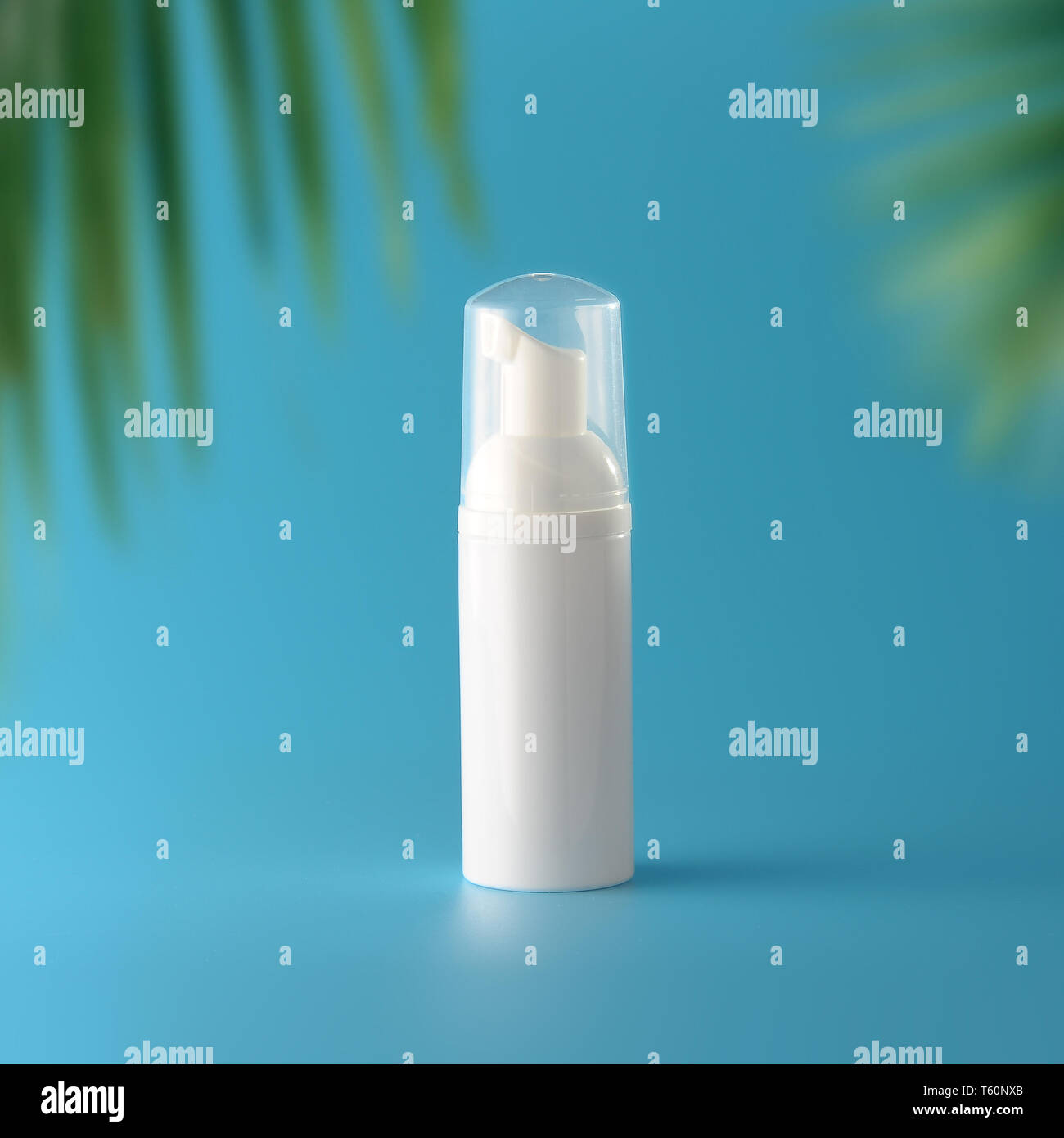 Set of cosmetic sun block on a blue background. Cosmetic package for ...