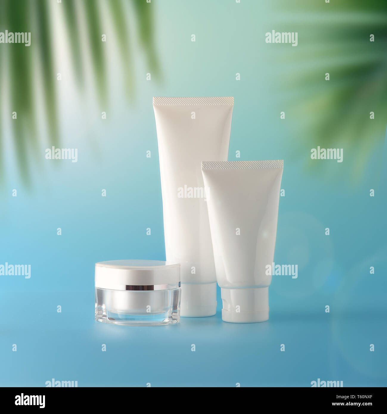 Set of cosmetic sun block on a blue background. Cosmetic package for ...