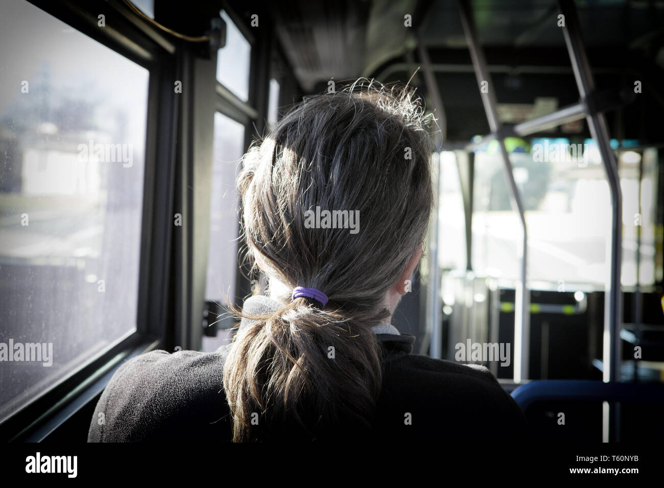Woman riding bus hi-res stock photography and images - Alamy