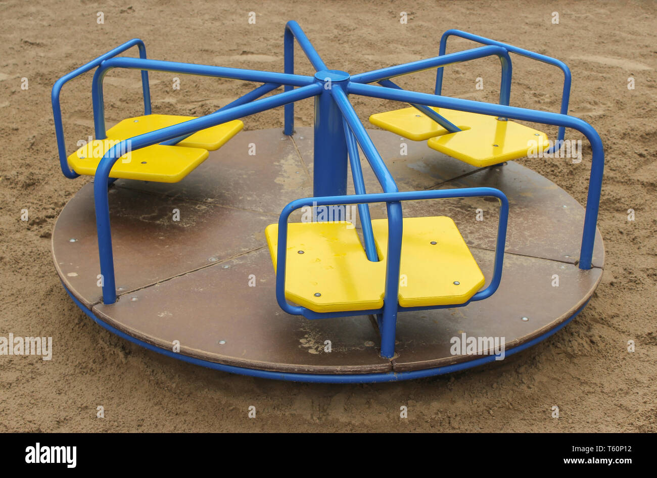 Children's carousel at the playground close-up Stock Photo - Alamy