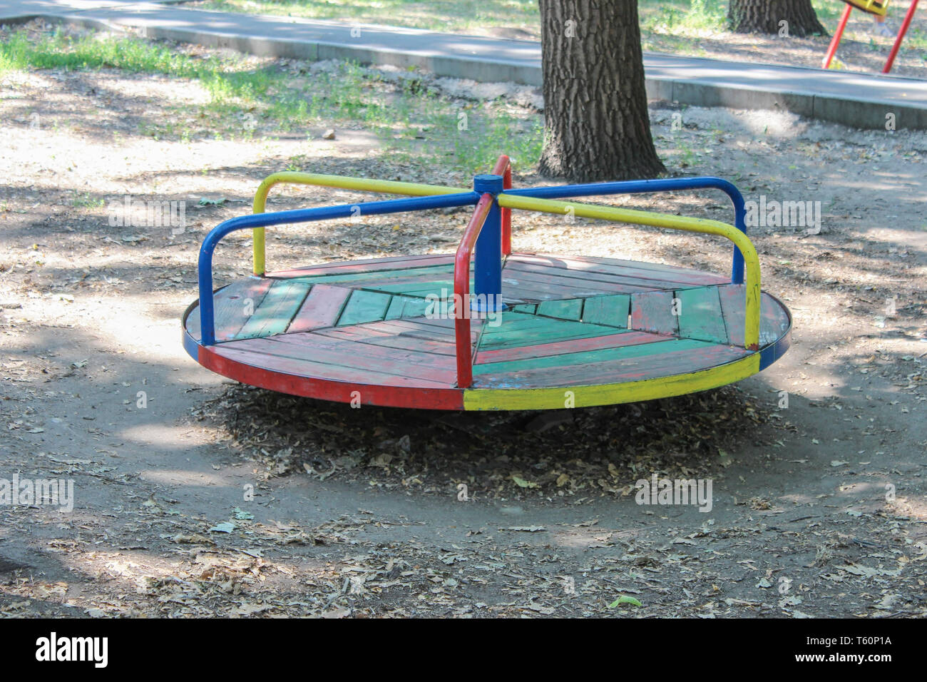 Carousel in the playground hi-res stock photography and images - Alamy