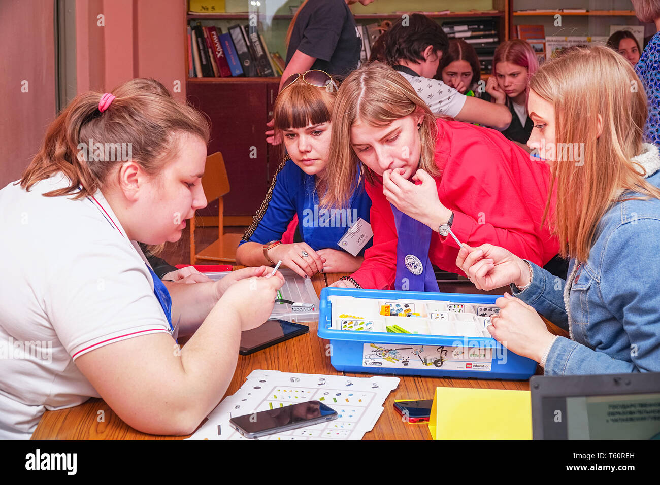 Robotics lesson with a set of Lego. Students design machine robots ...