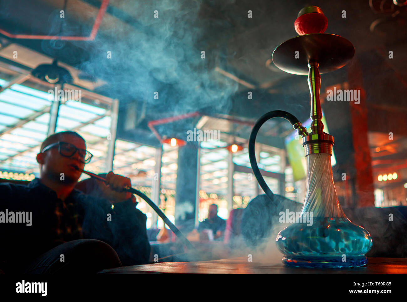 Middle eastern shisha pipe smoking hi-res stock photography and images ...