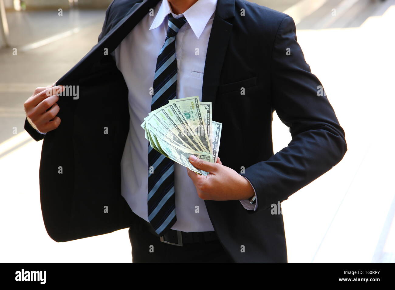 business man is showing his money that the perfect deal.the worker show ...