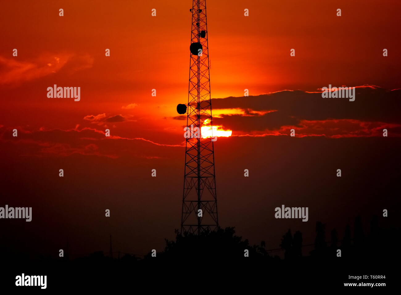 the telacommunication pole or mobile pole with sun set sky background ...