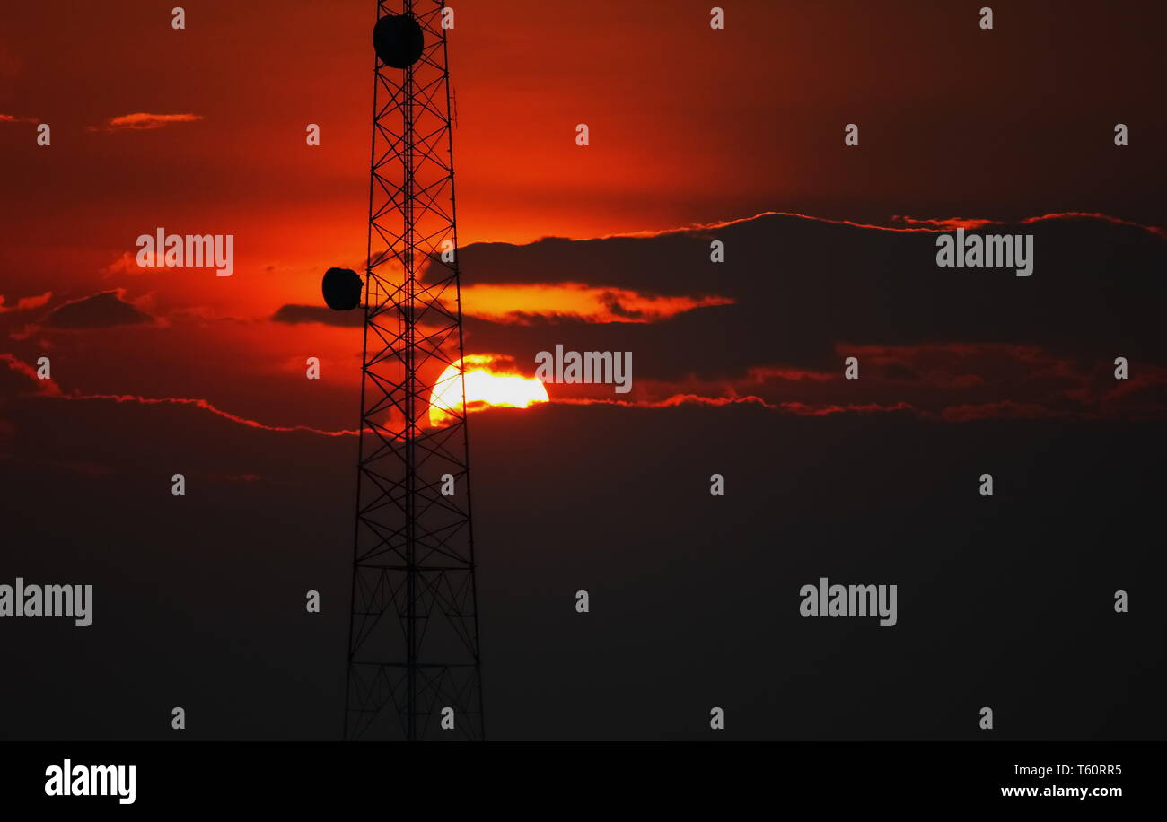the telacommunication pole or mobile pole with sun set sky background ...