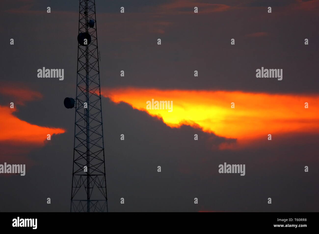 the telacommunication pole or mobile pole with sun set sky background ...