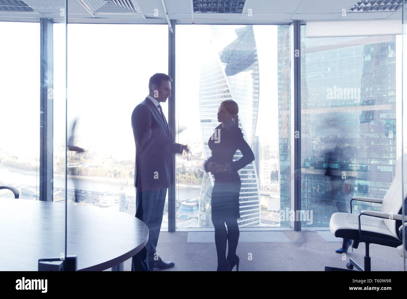 Business people talking in a conference room with city skyline Stock ...