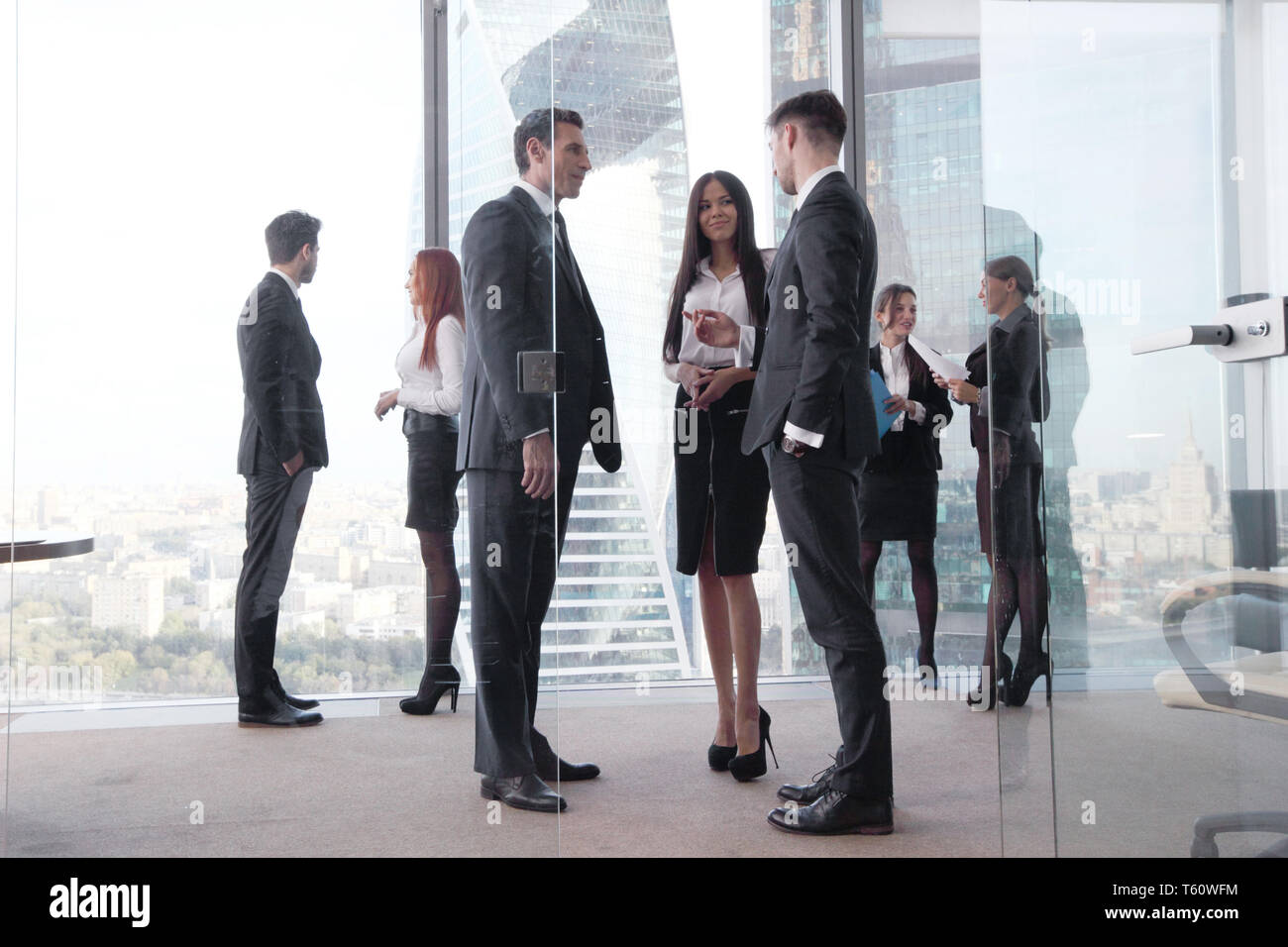 Business people talking in a conference room with city skyline Stock ...