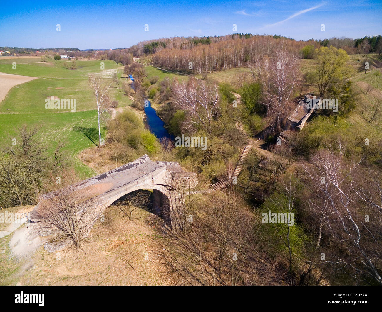 Destroyed railway bridge over Sapina river, Kruklanki town in the ...