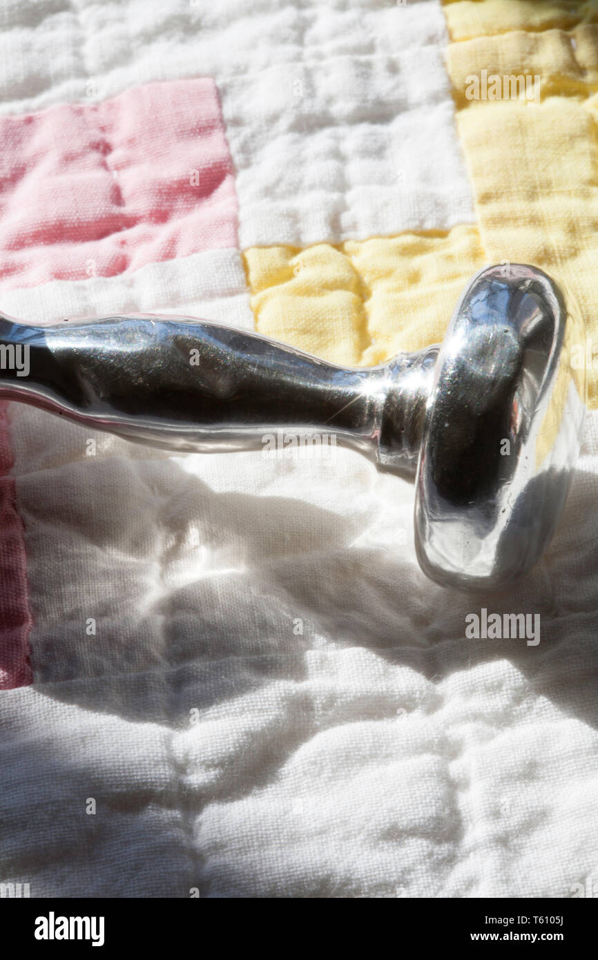 Silver baby rattle hi-res stock photography and images - Alamy