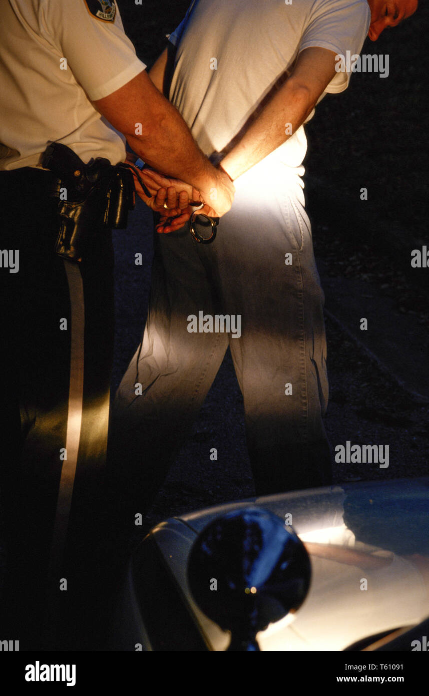 Handcuffing hi-res stock photography and images - Alamy