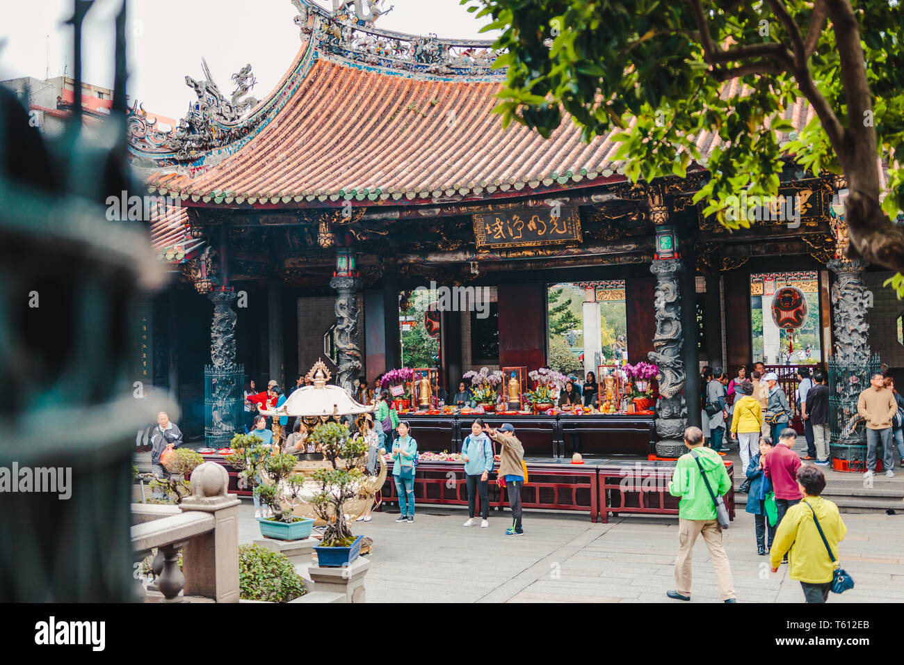 Main entrance gate at Longshan Temple with tourist and local people ...