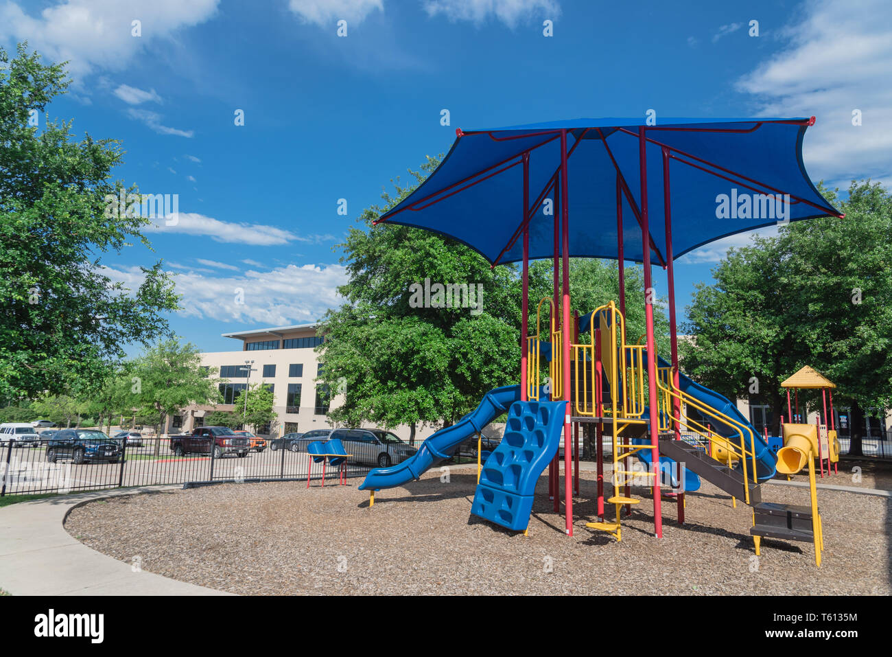 Neighborhood playground with colorful structure equipment near Dallas ...