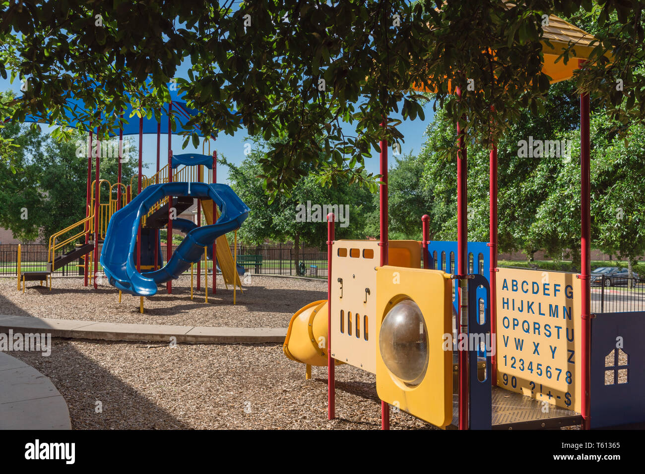 Neighborhood playground with colorful structure equipment near Dallas ...