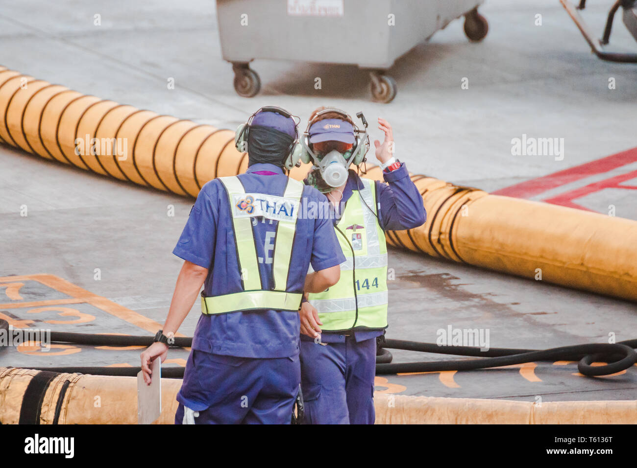Bangkok airport ground crew hi-res stock photography and images - Alamy