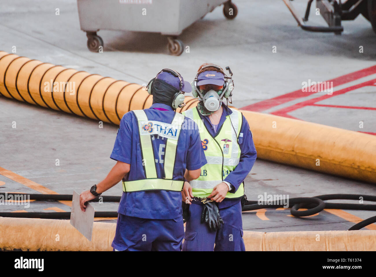 Bangkok airport ground crew hi-res stock photography and images - Alamy