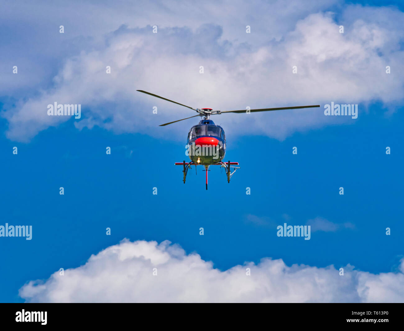 Flying helicopter airplane in blue sky with clouds. outdoors Stock ...