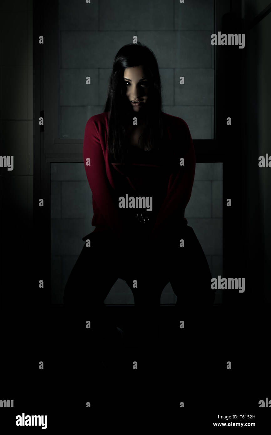 Ghost girl sitting in font of a window Stock Photo - Alamy