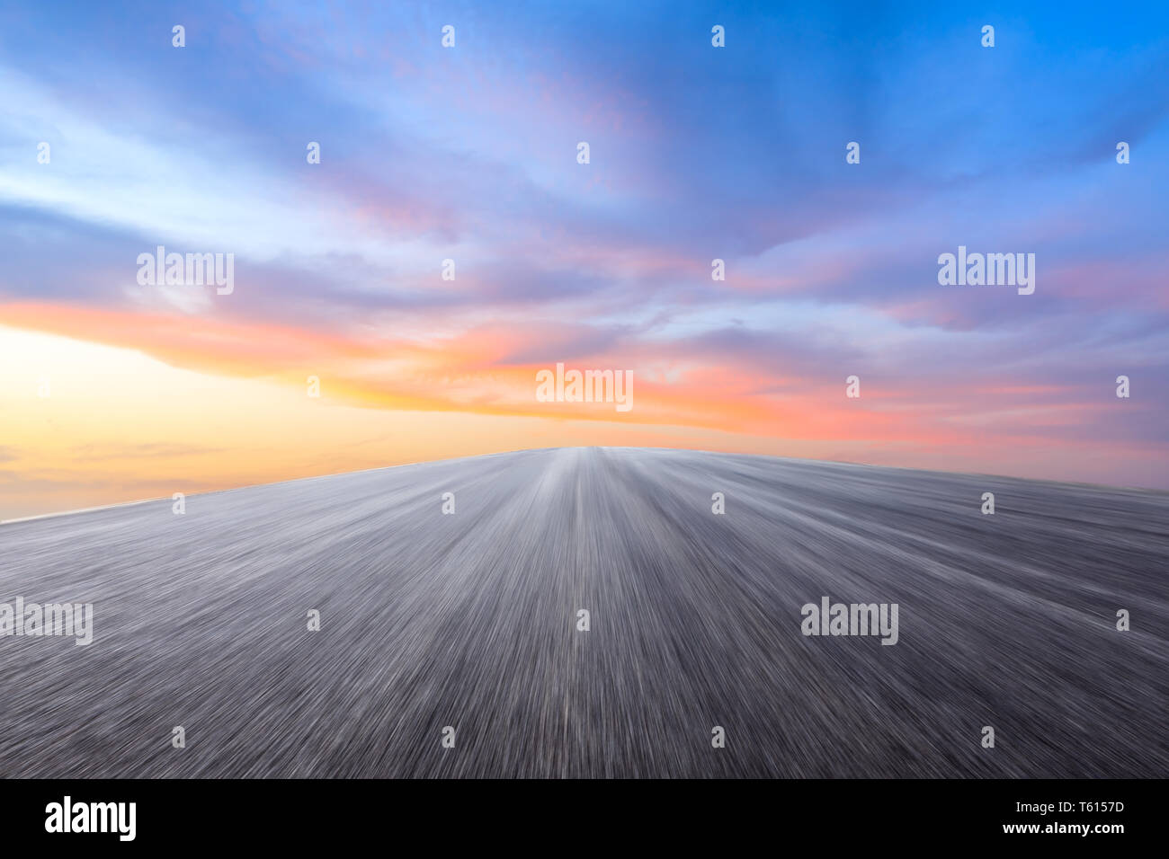 Motion blurred asphalt road ground and sky sunset clouds Stock Photo ...