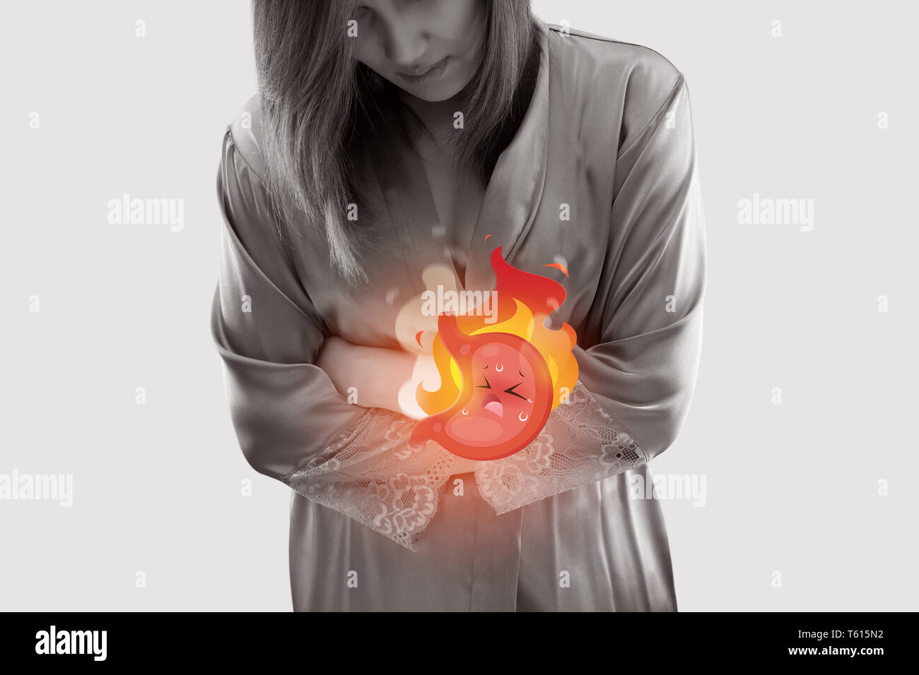 The photo of cartoon stomach on woman's body against a gray background ...