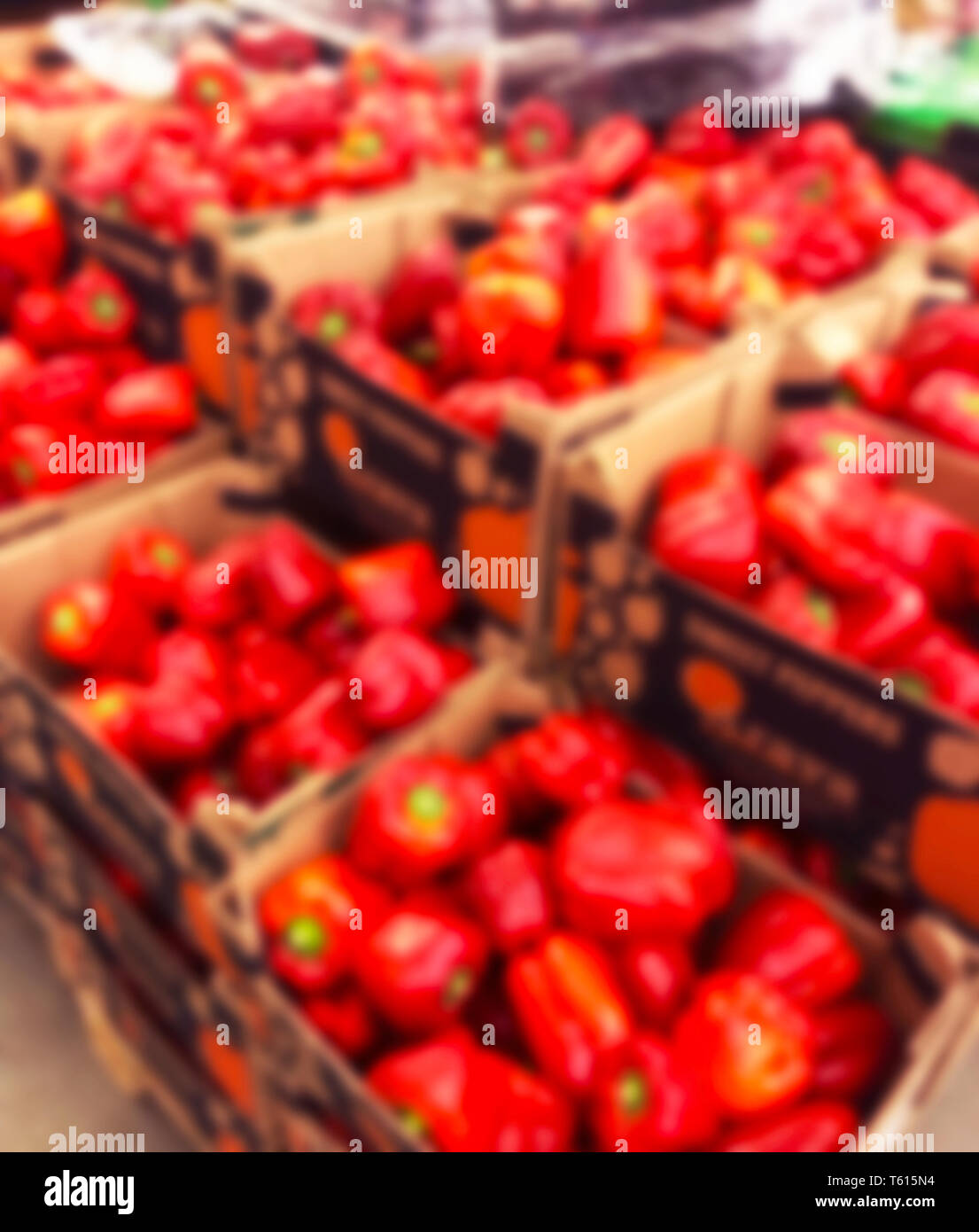 Blurred bacground with Fresh pods of red peppers i supermarket store ...