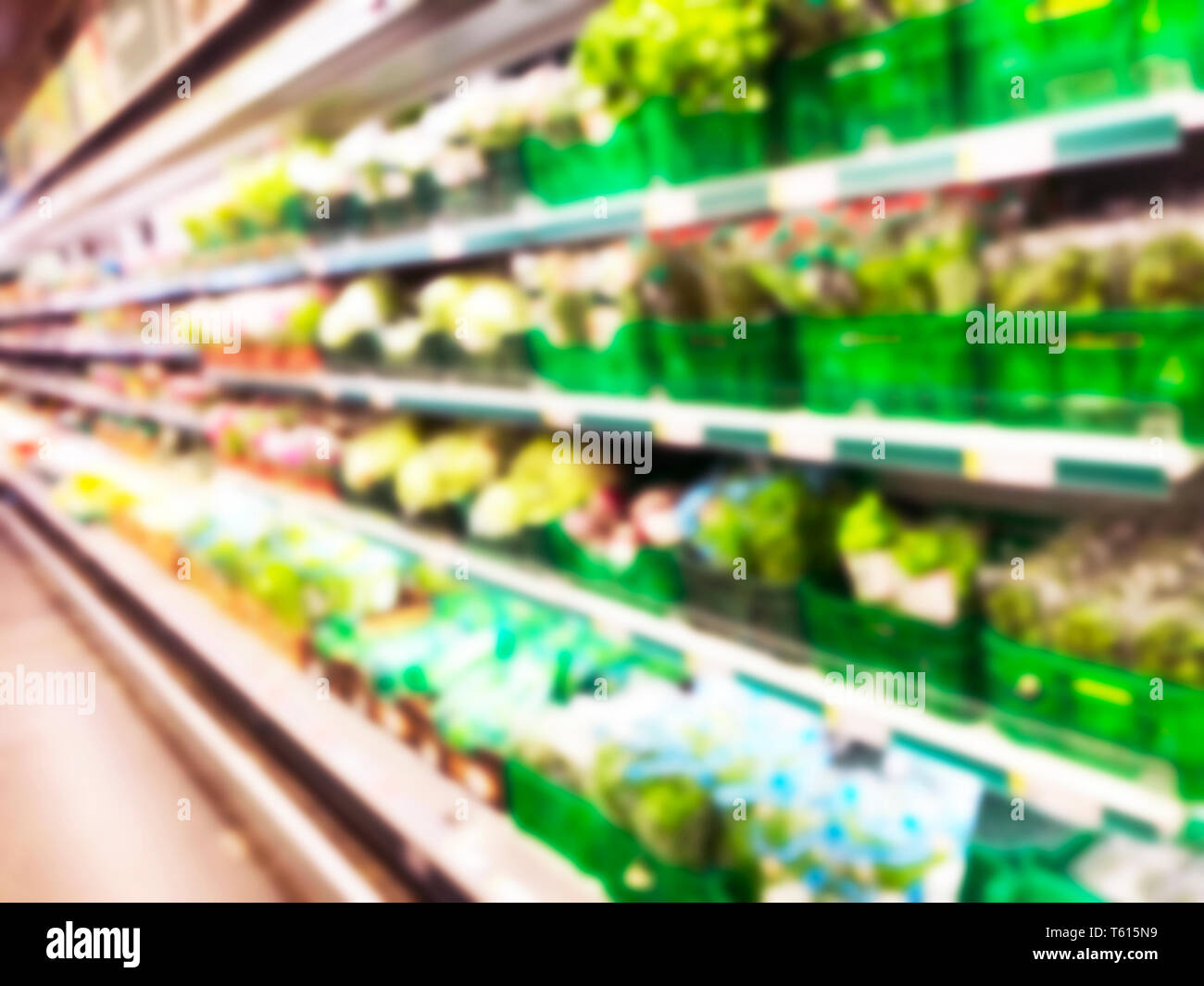 Blurred fresh fruits and vegetables at retail store. Abstract ...