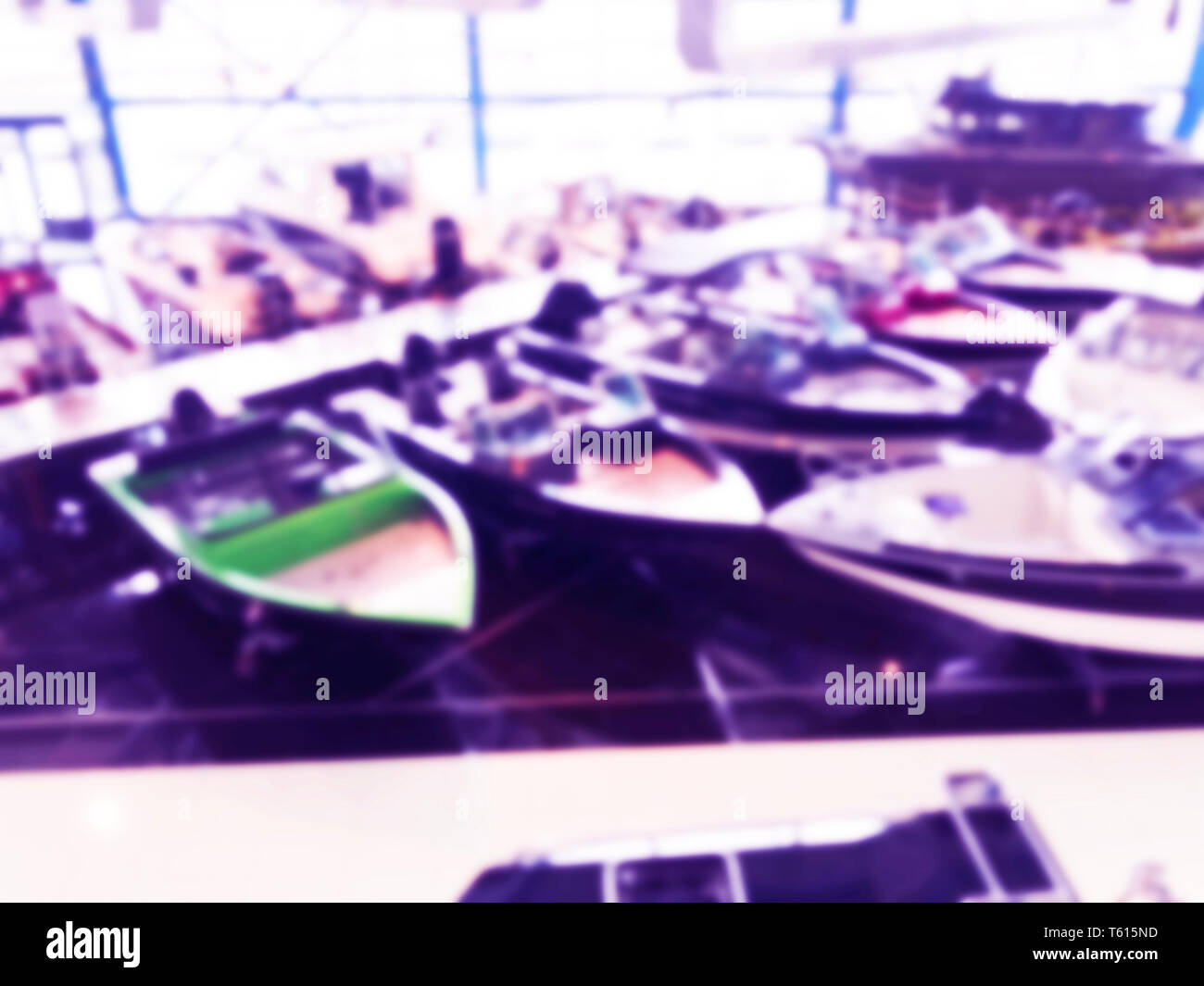 Blurred background with fishing motor boat in the dealership store ...