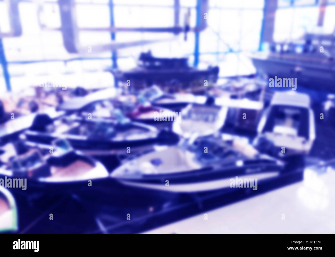 Blurred background with fishing motor boat in the dealership store ...