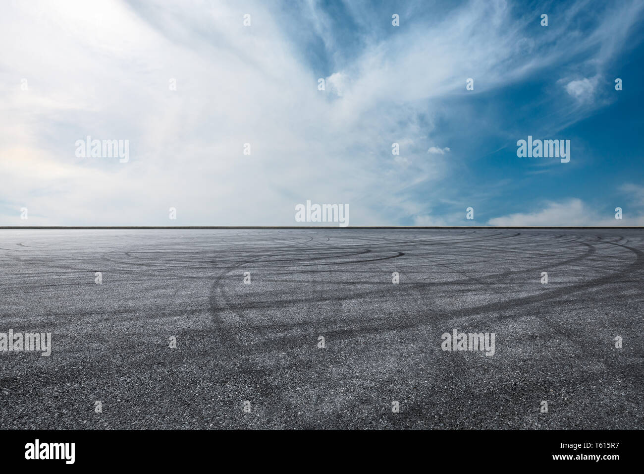 Empty asphalt race track ground and beautiful sky clouds Stock Photo ...