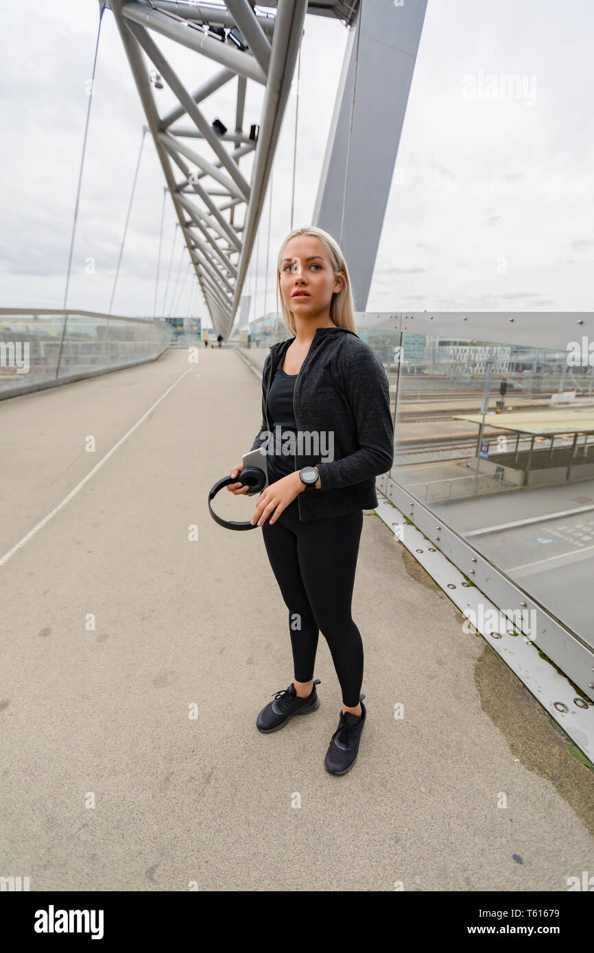 Beautiful Fitness Woman Runner Standing on Modern Bridge In City Stock ...