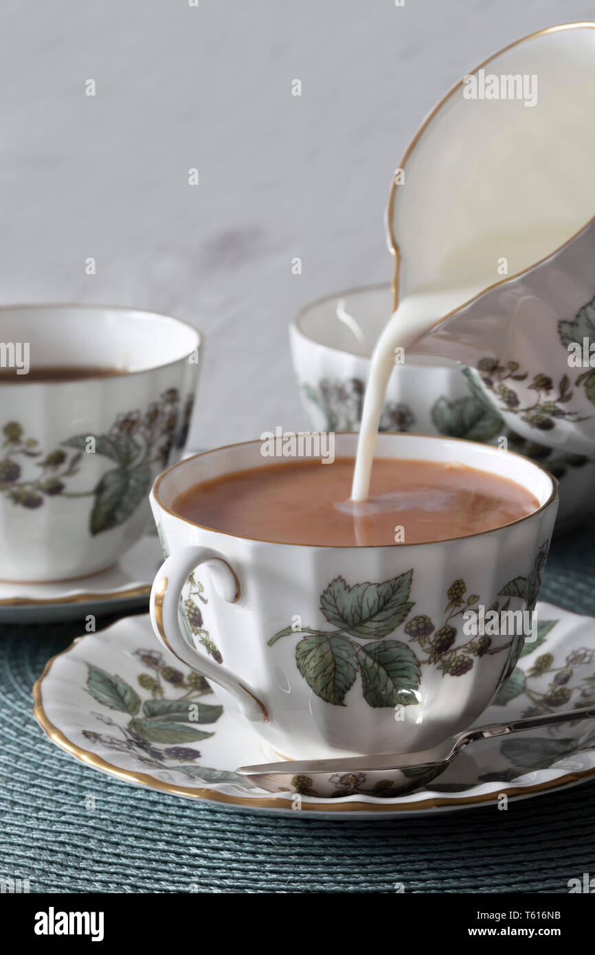 Tea Being Poured Into A Tea Cup Stock Photos & Tea Being Poured Into A ...