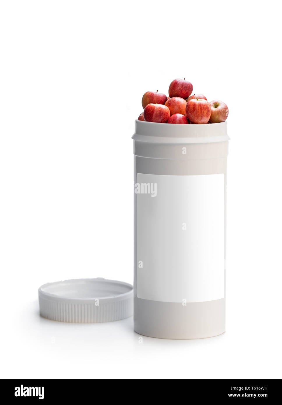 Swap your pills to a fresh red apples. Concept of nature made vitamin ...