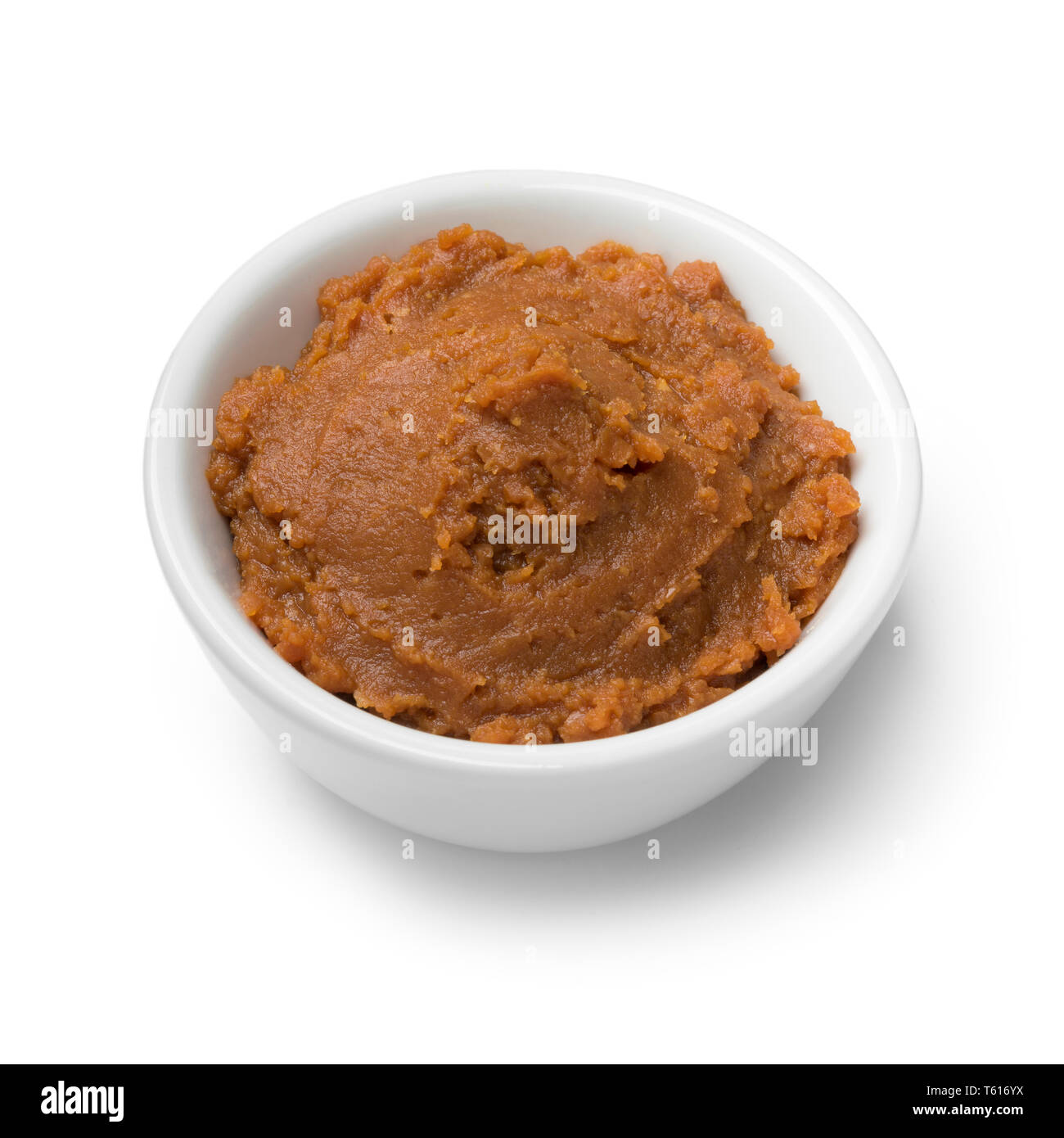 Bowl with Japanese miso paste as an ingredient isolated on white ...